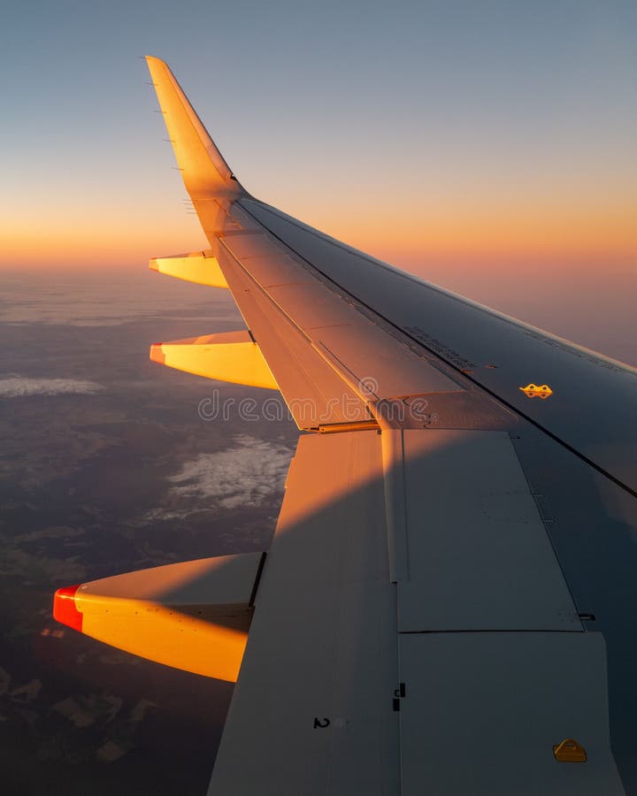 Airplane Wing Under the Light of Sunset Stock Image - Image of business ...
