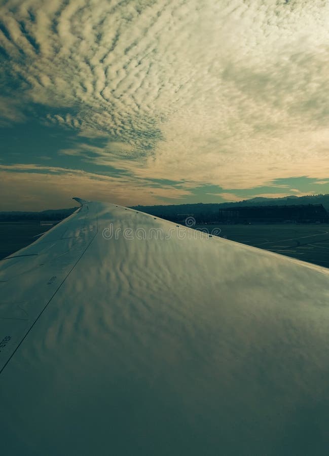 Airplane Wing with Wavy Cloud Reflection Stock Photo - Image of clean ...