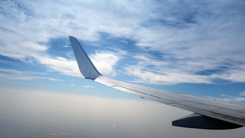 Airplane wingon the sky stock photo. Image of aluminium - 80220882