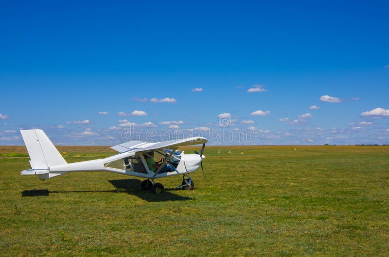 Airplanes on the Airfield Against the Sky with Clouds. Small Aircraft ...