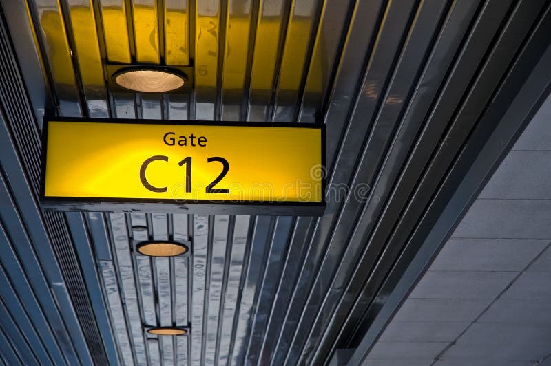 Airport Boarding Gate Sign stock image. Image of holding - 1143845