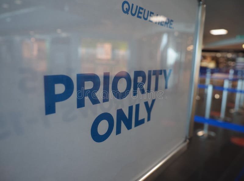 Airport Priority only Queue Here Sign Stock Photo - Image of queue ...
