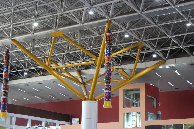 Airport Terminal Ceiling with Supporting Poles and Decorative Hangings ...