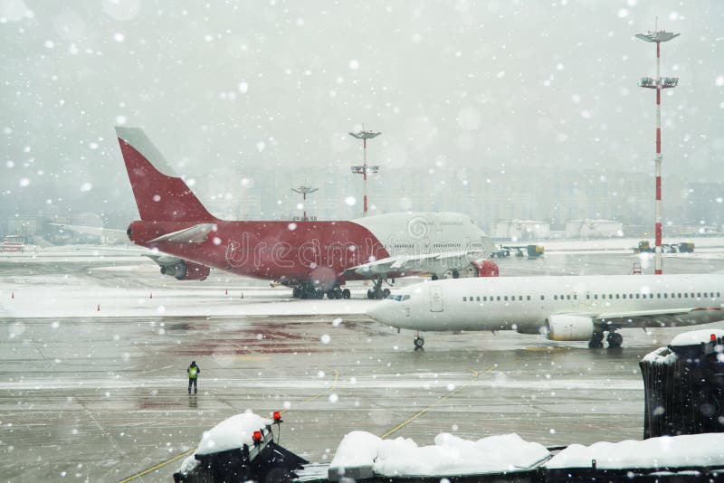 Airport under snowfall stock image. Image of plane, frost - 197379121