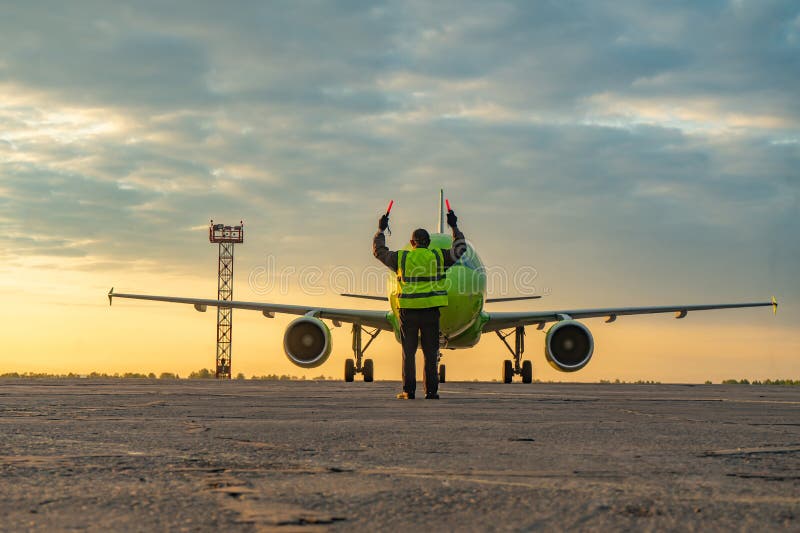 Airport Worker Standing in Front of the Airplane at the Airport ...