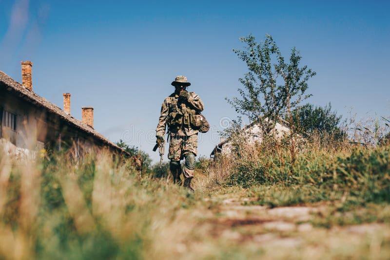 Airsoft Solder on Battlefield. Airsoft Soldier with a Rifle. Stock ...