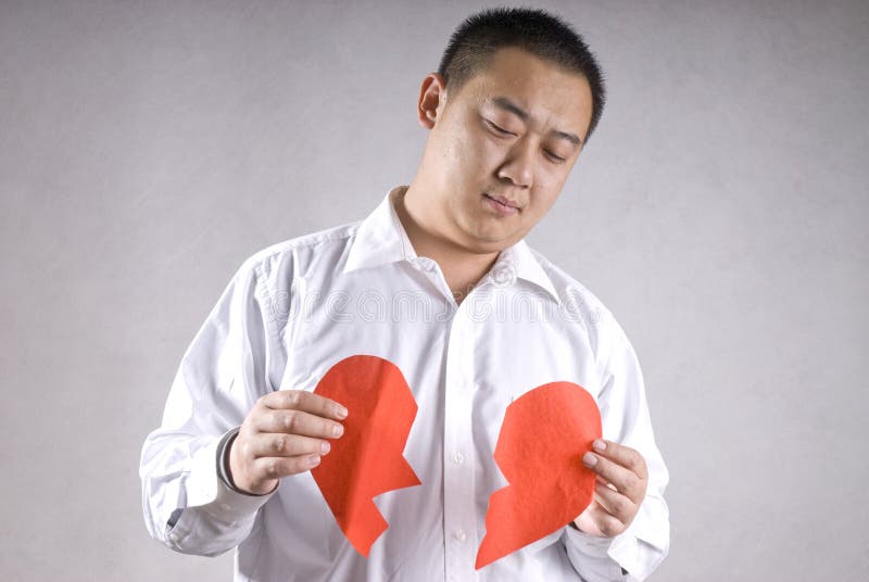 Aisa man with broken heart stock image. Image of heart - 8053269