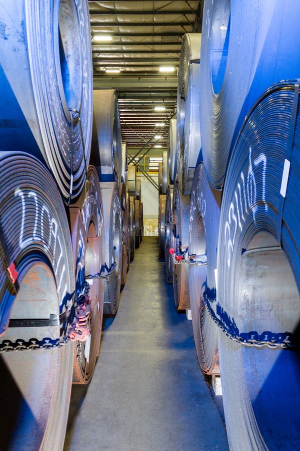 Aisle between Rows of Stacked Master Coils Stock Photo - Image of steel ...