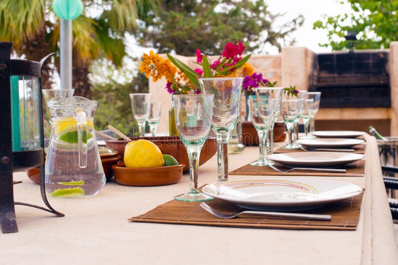Al fresco table setting stock photo. Image of glasses - 49212306