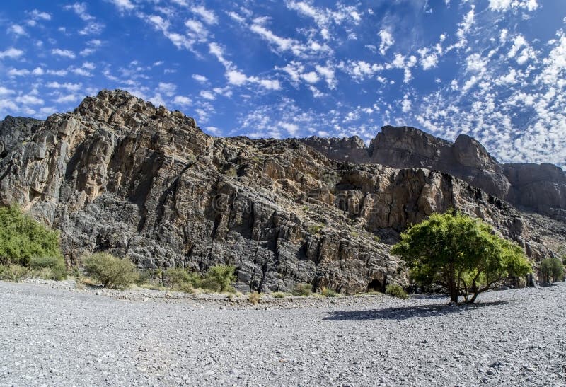 Al Hajar Mountains in Oman stock photo. Image of clouds - 65265570