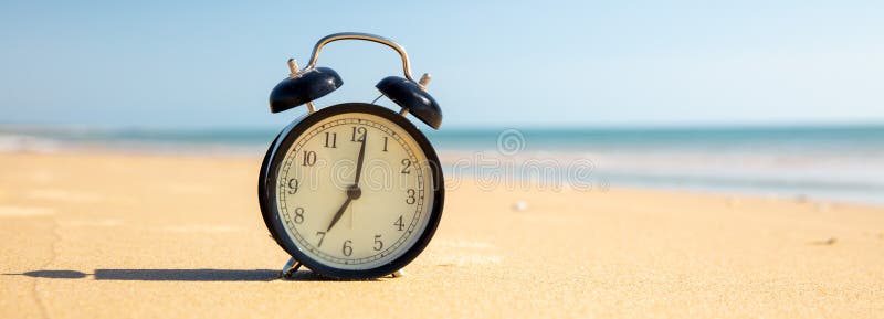 Alarm clock on the beach stock photo. Image of summer - 321144522