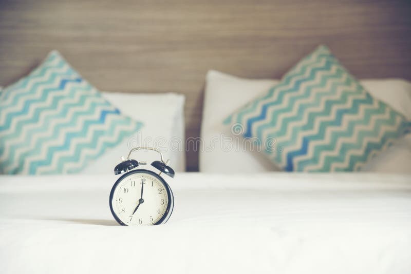 Alarm Clock on Bed in Luxury Bedroom in Hotel Stock Photo - Image of ...
