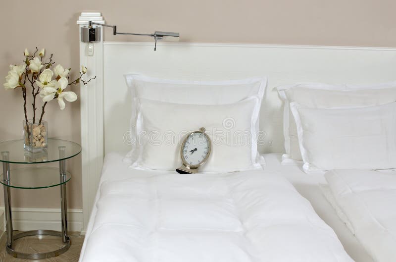 Alarm Clock on a Bed stock image. Image of alert, linen - 80439261