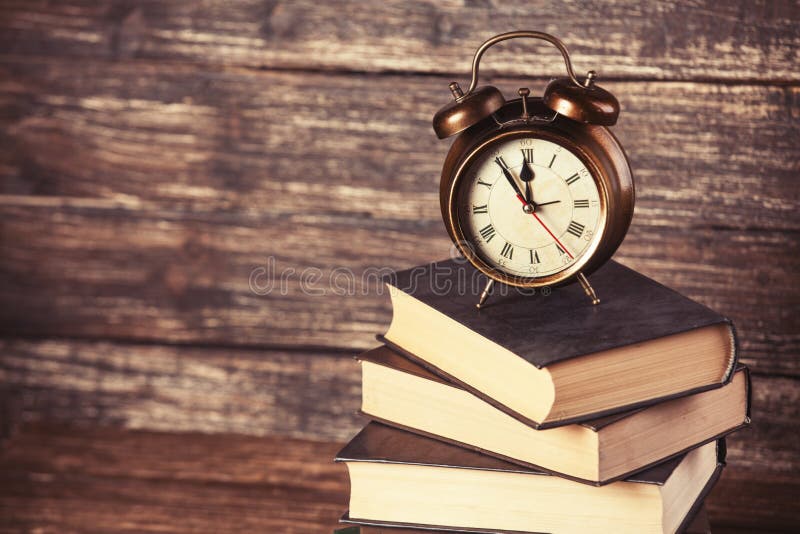 Alarm clock and books stock image. Image of layout, design - 41592685