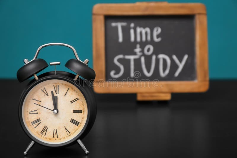 Alarm Clock and Chalkboard with Phrase "Time To Study " on Table ...