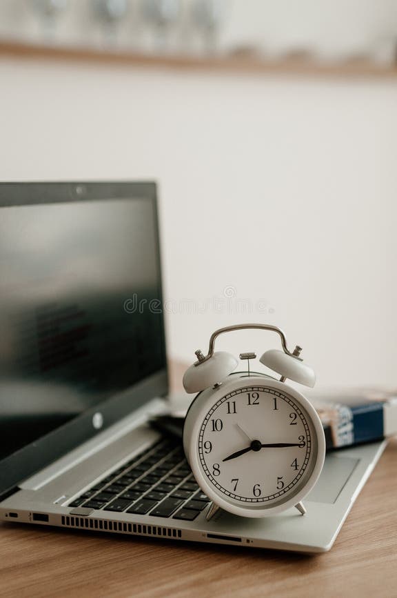 Alarm Clock on Desktop, Laptop and Notebook for Work Stock Image ...