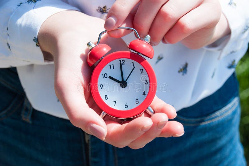Alarm Clock in Female Hands. Symbol of Fast Passing Time Stock Photo ...
