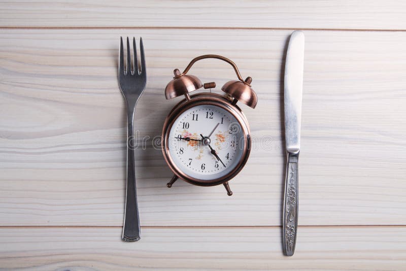 Alarm Clock with Fork and Knife Lunch Time Stock Image - Image of ...
