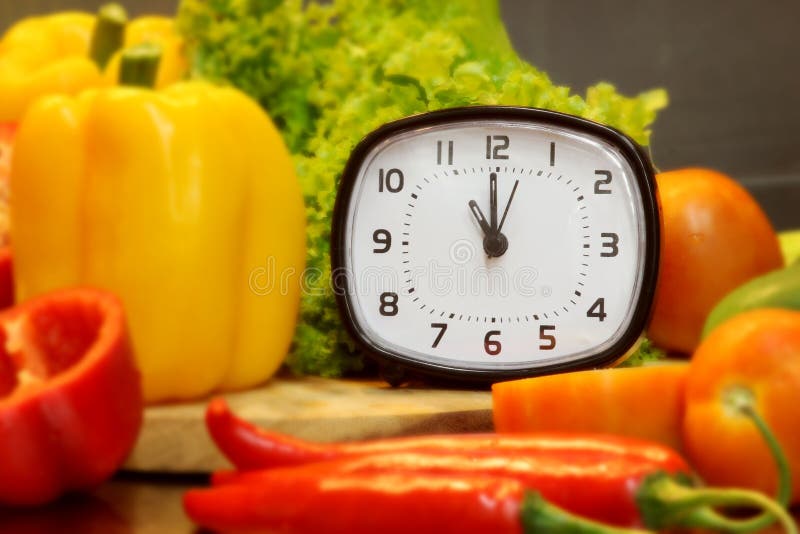 Alarm Clock with Fresh Vegetables for Cooking,focus of Alarm Clock ...