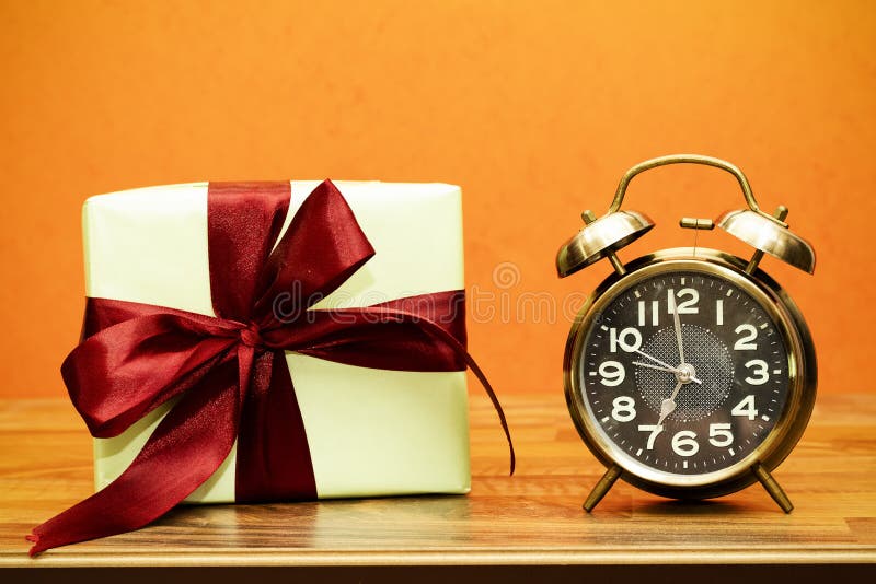 Alarm Clock and Gift Box Wood Table Stock Image - Image of greeting ...