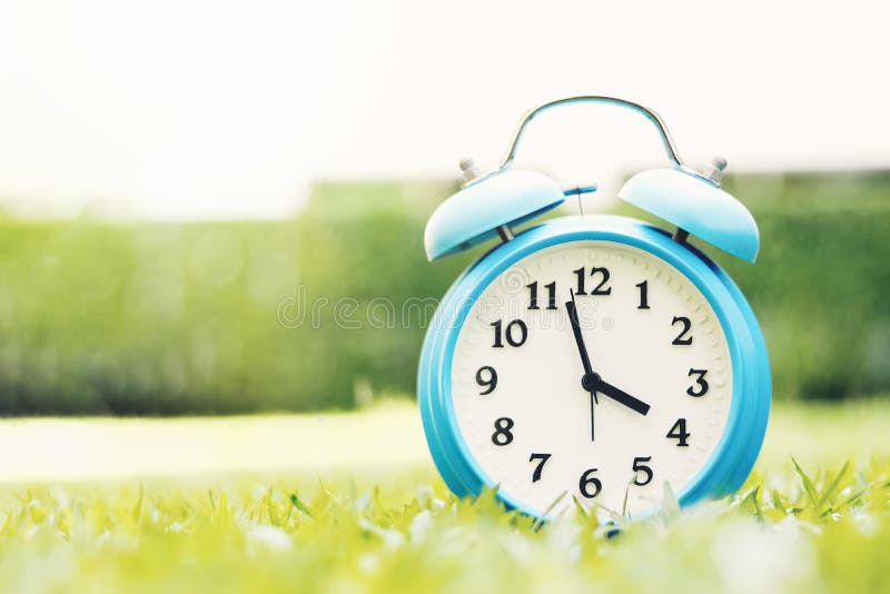 Alarm Clock on Grass in the Afternoon Stock Image - Image of watch ...