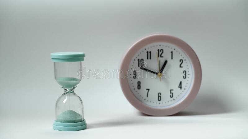 Close-up. a White Alarm Clock with Sixty Minutes Moving Fast and ...