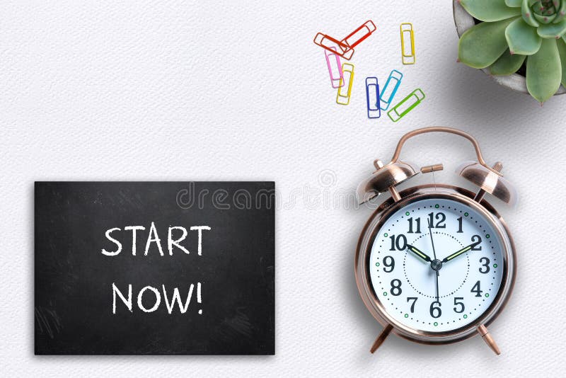 Alarm Clock Next To Slate Plate with Text `Start Now!` Stock Image ...