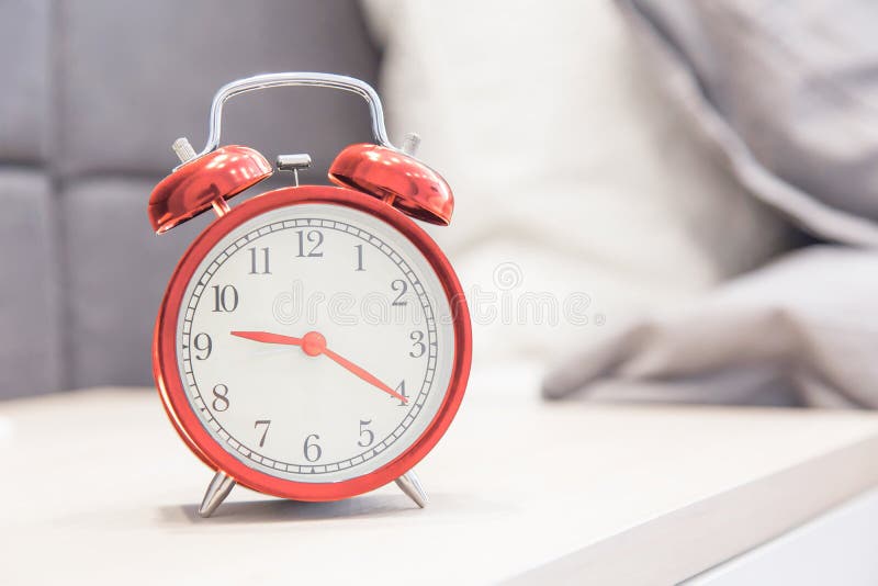 Alarm Clock on the Nightstand beside the Bed. Interior Bedroom Stock ...