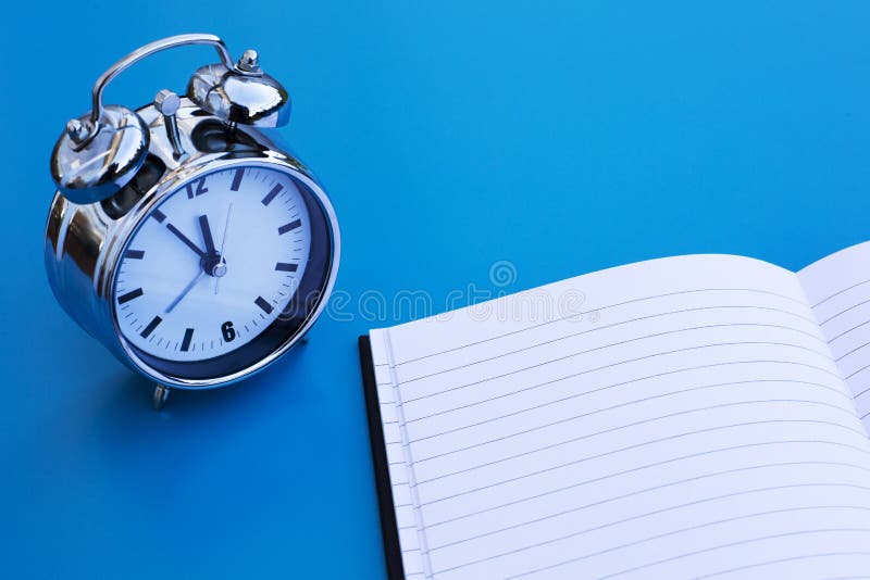 Alarm clock with notepad stock photo. Image of classroom - 60797092