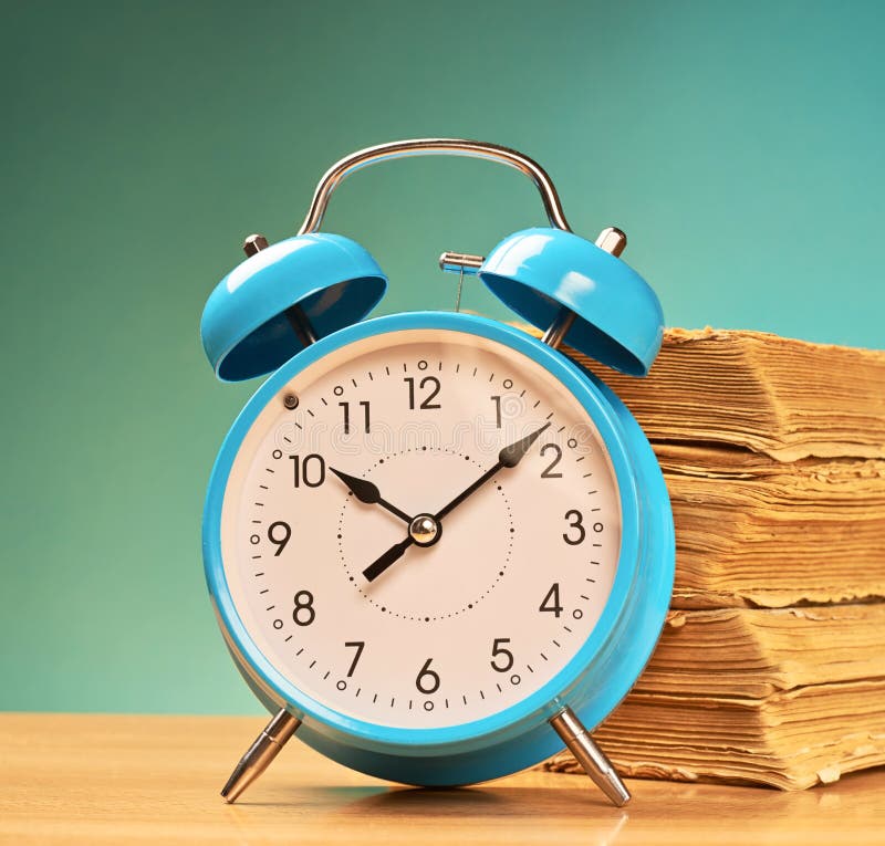 Alarm clock and old books stock photo. Image of knowledge - 45909010