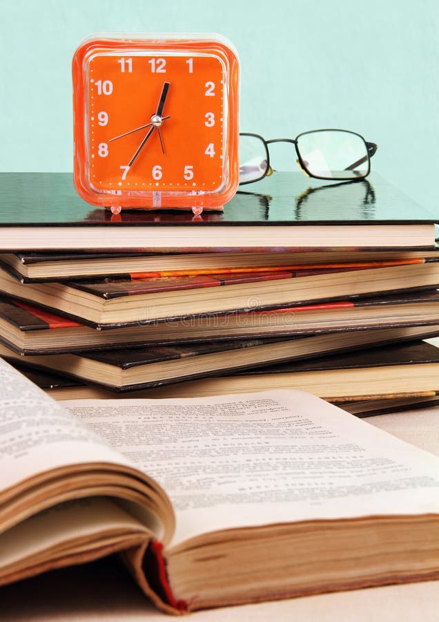 Alarm clock and books. stock image. Image of objects - 30105945