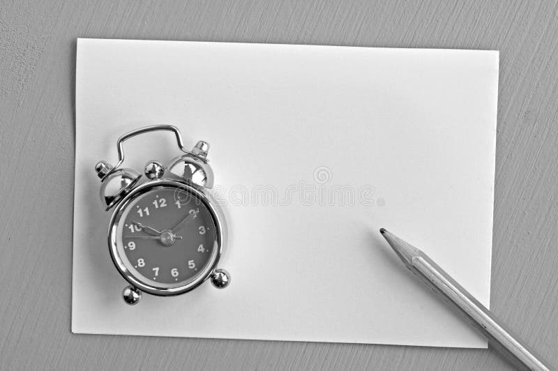 Alarm clock on paper stock image. Image of momentum, clock - 45608953