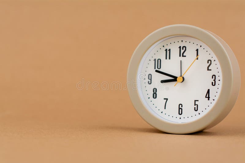 Clock Photography in a Light Brown Background Studio the Concept of ...