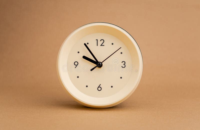Clock Photography in a Light Brown Background Studio the Concept of ...