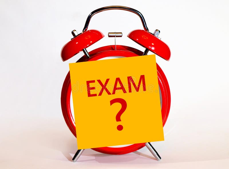 An Alarm Clock and a Yellow Note with Text Exam? Stock Image - Image of ...