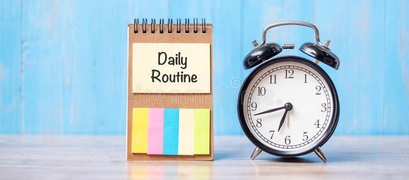 Alarm Clock with daily Routine Note Paper on Wooden Table Background ...