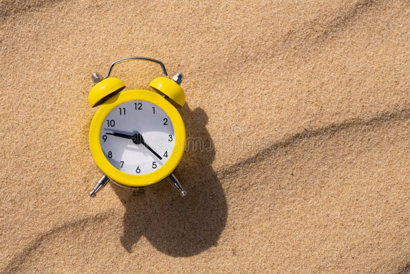 Alarm Clock on the Sand in the Desert on a Sunny Day with a Shadow ...