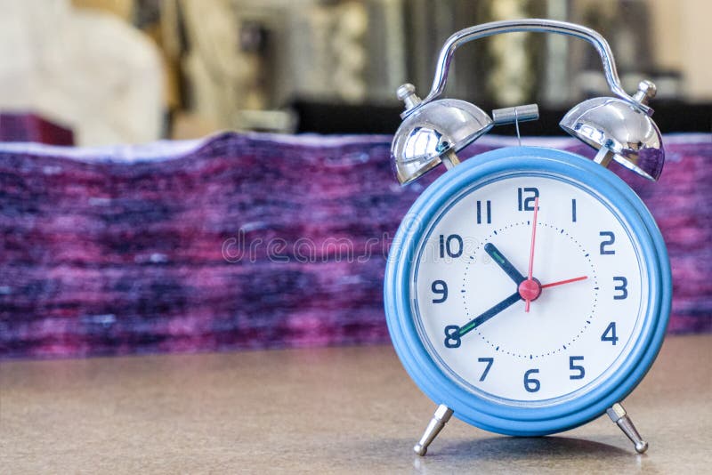 The Alarm Clock Shows the Time at the Workplace. Working Hours Stock ...