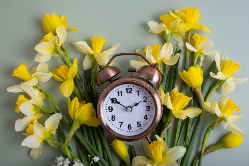 Alarm Clock with Spring Flowers Top View. Spring Time, Daylight Savings ...