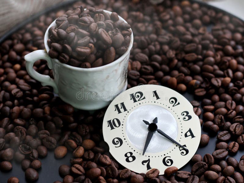 Alarm Clock Standing and a Beans of Coffee. Coffee Time Concept Stock ...