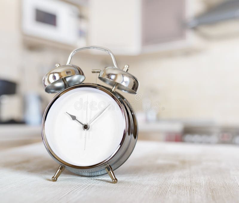 Alarm Clock on a Table in the Kitchen Stock Photo - Image of morning ...