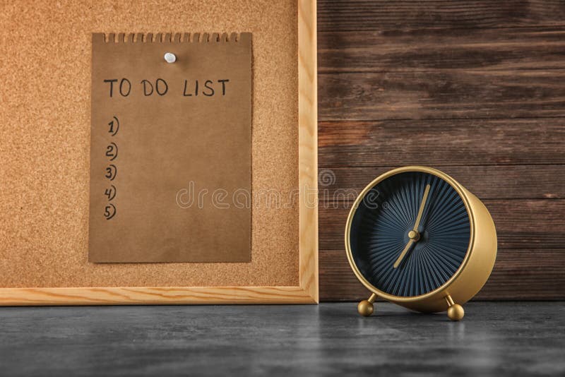 Alarm Clock on Table and Sheet of Paper with To-do List on Board. Time ...