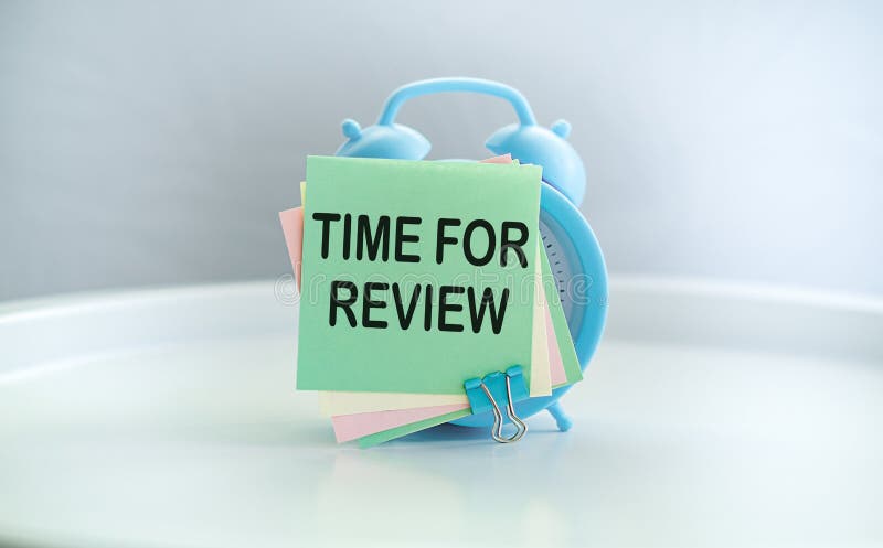 Alarm Clock with Text Time for Review Over Sand Background. Stock Image ...