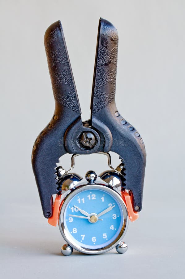 Alarm clock under pressure stock photo. Image of dial - 36495076