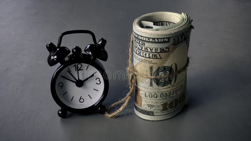 Alarm Clock with USD Money Representing Time and Financial Value Stock ...