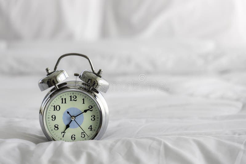Alarm Clock on White Blanket in Bed Room Stock Image - Image of ...