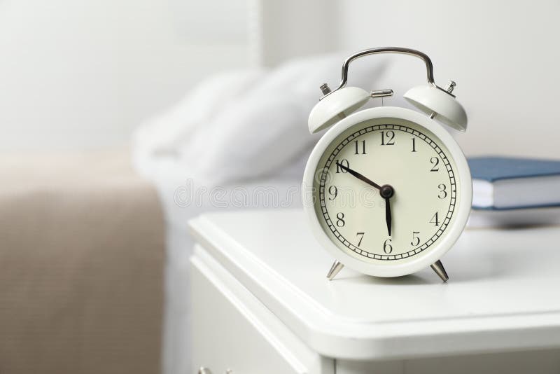 Alarm Clock on White Nightstand in Bedroom, Space for Text Stock Image ...