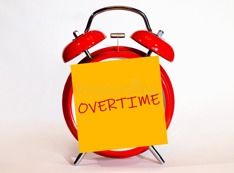 An Alarm Clock and a Yellow Note with Text Overtime? Stock Image ... An Alarm Clock and a Yellow Note with Text Overtime? Stock Image ...