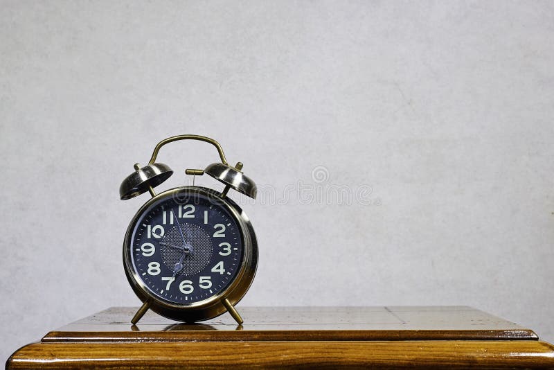 Alarm O Clock Showing 7 O Clock on Wood Table. Stock Image - Image of ...