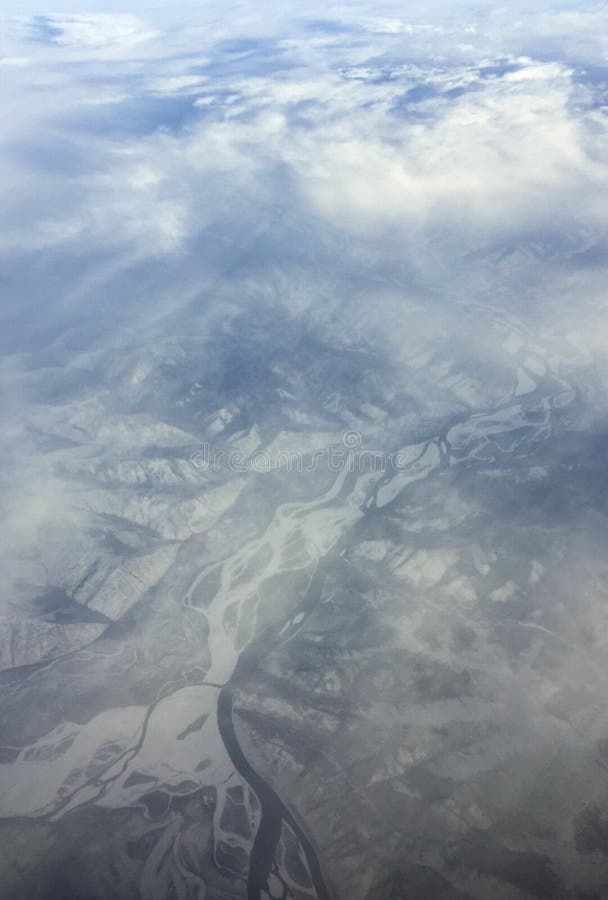 Alaskan River Winds Down Valley Under a Cloud Deck Stock Image - Image ...